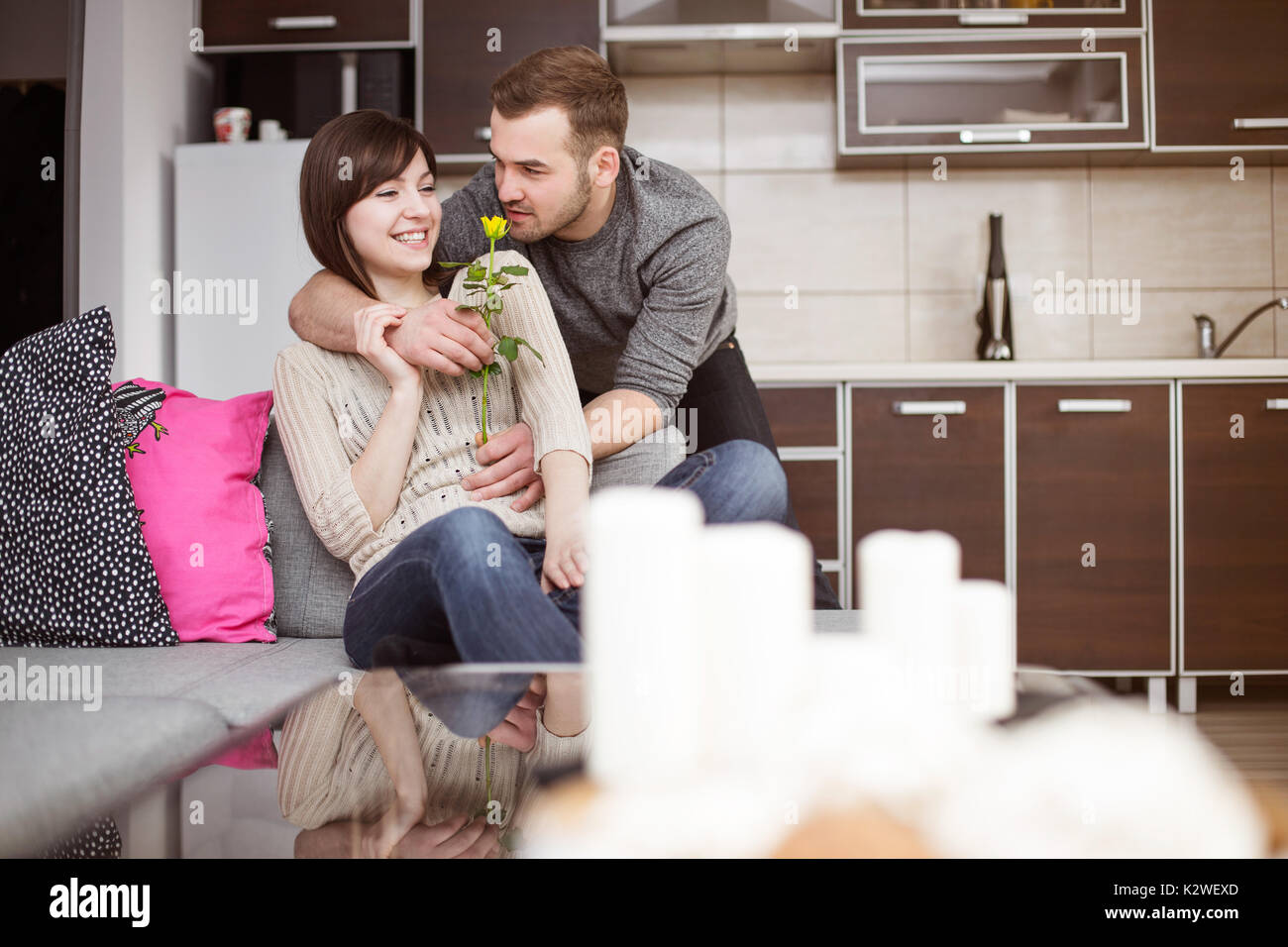 Couple flirting on sofa hi-res stock photography and images - Alamy