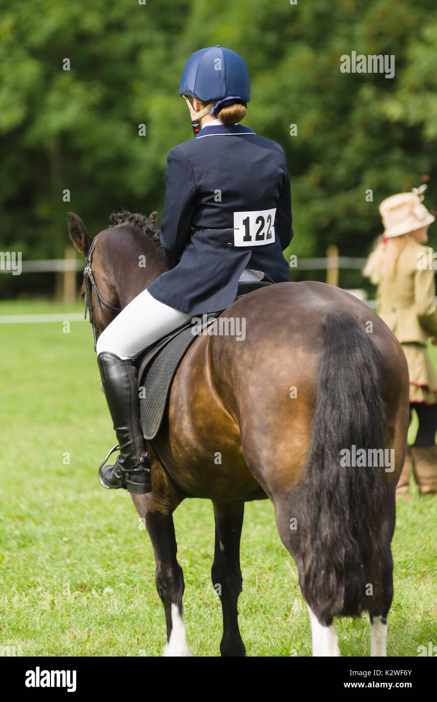 Young rider and her pony competing in the gymkhana at the annual ...