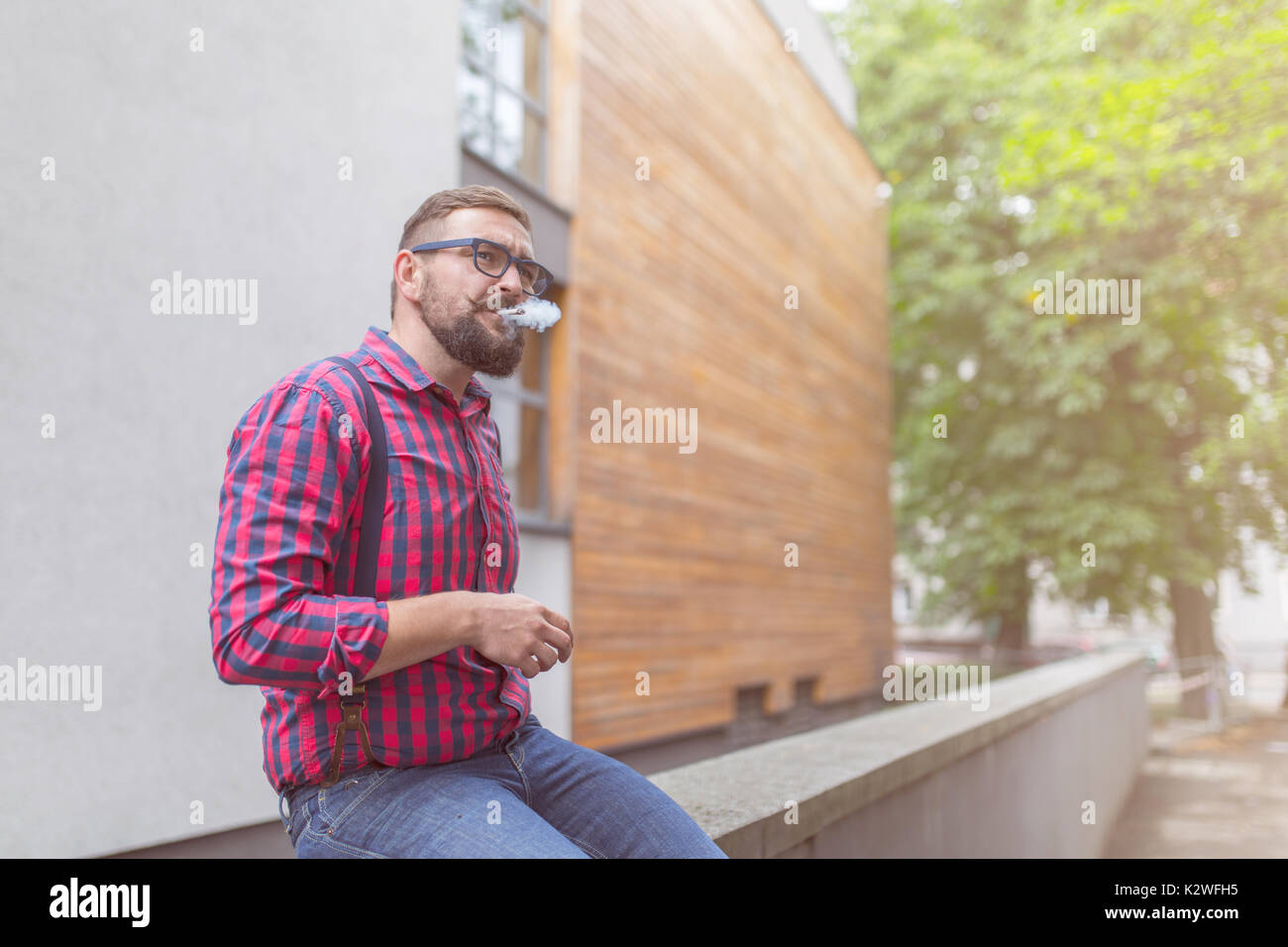 Man smoking joint outdoors Stock Photo - Alamy