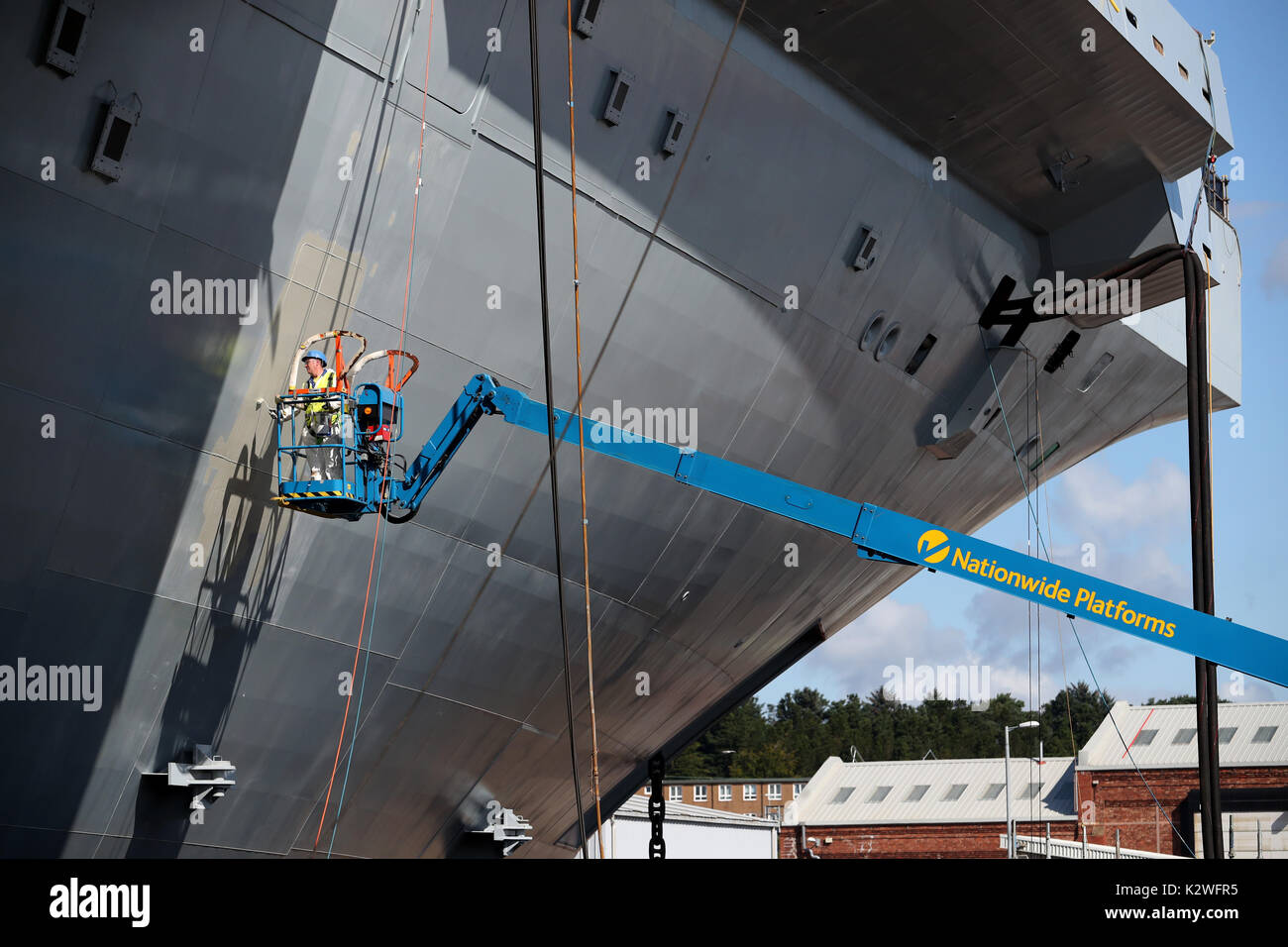 The hull of the HMS Prince of Wales is painted as works continue on the ...