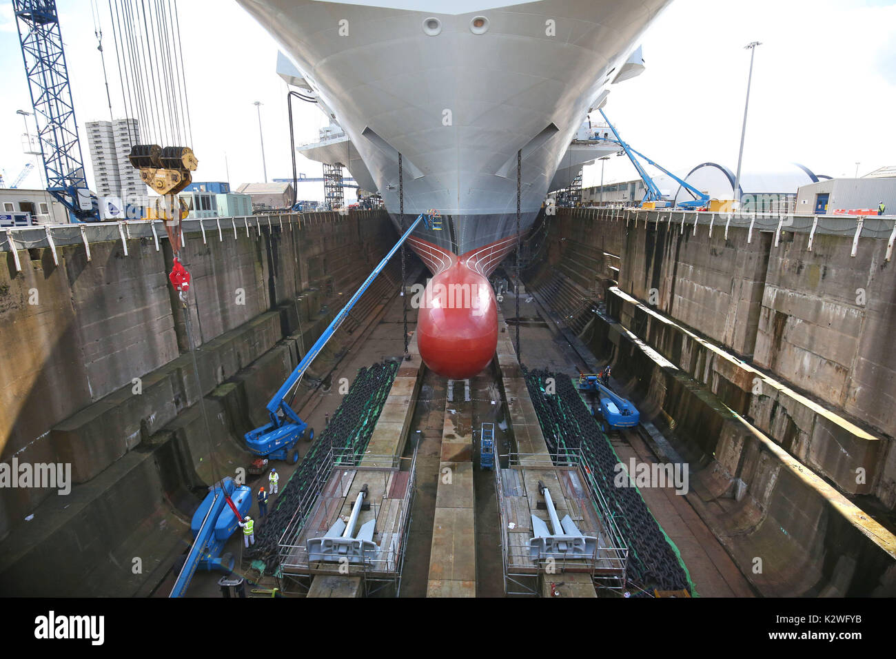 The hull of the HMS Prince of Wales is cleaned as works continue on the ...