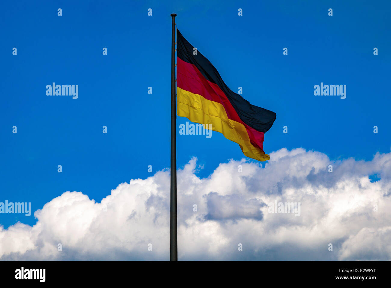 German Flag with bright sky Stock Photo - Alamy