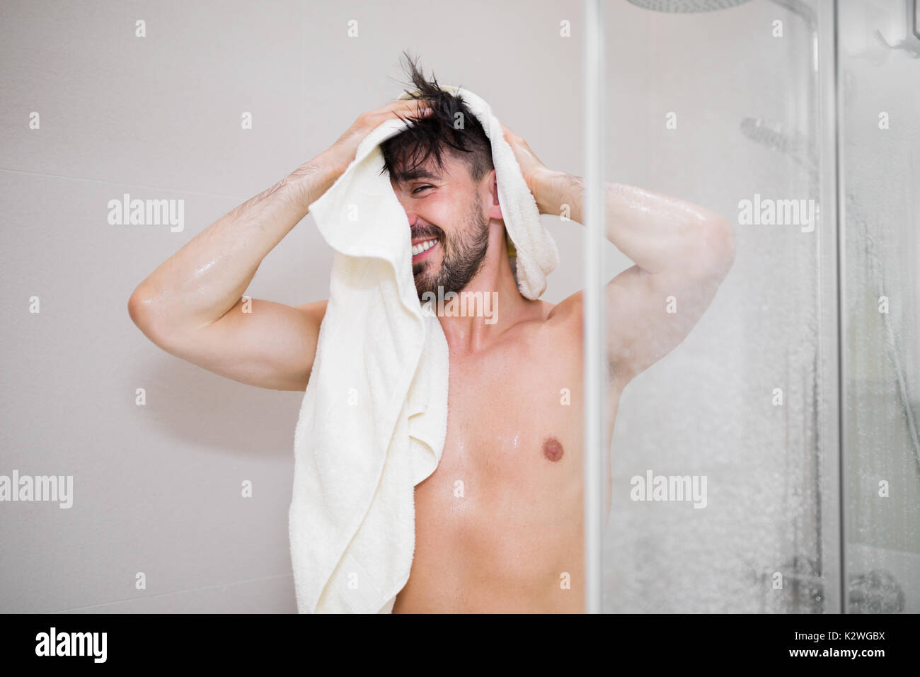 Young man taking shower hi-res stock photography and images - Alamy