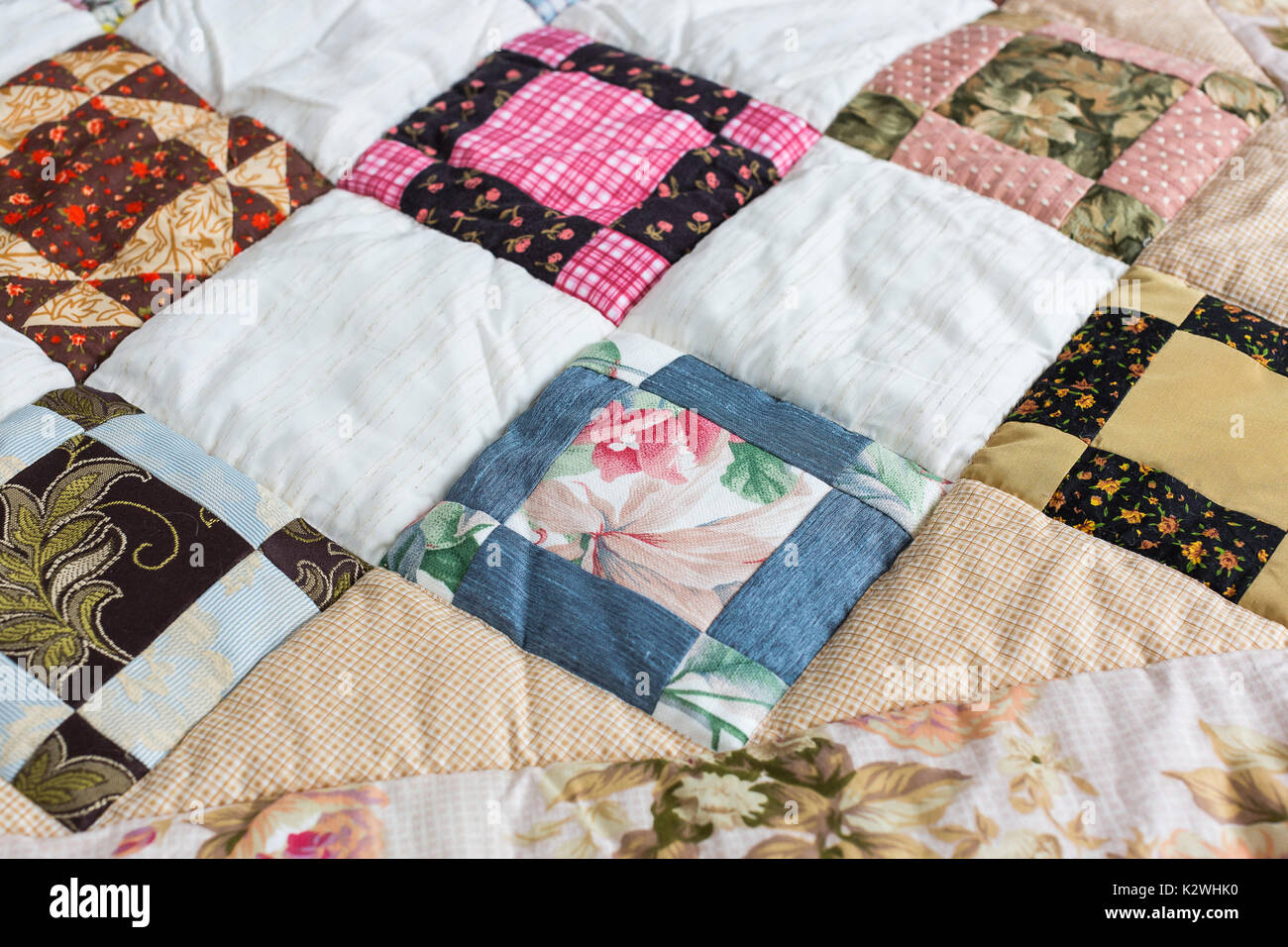 hobby, quilt, art concept. close up on piece quilt blanket patterned by ...