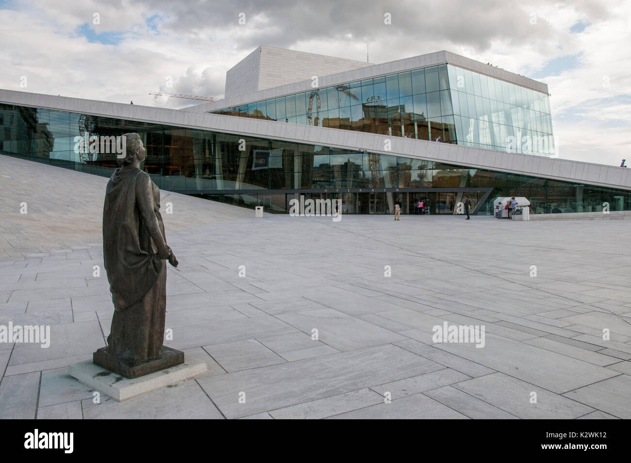 Exterior of Oslo Opera House and plaza with statue of Norway's famous ...