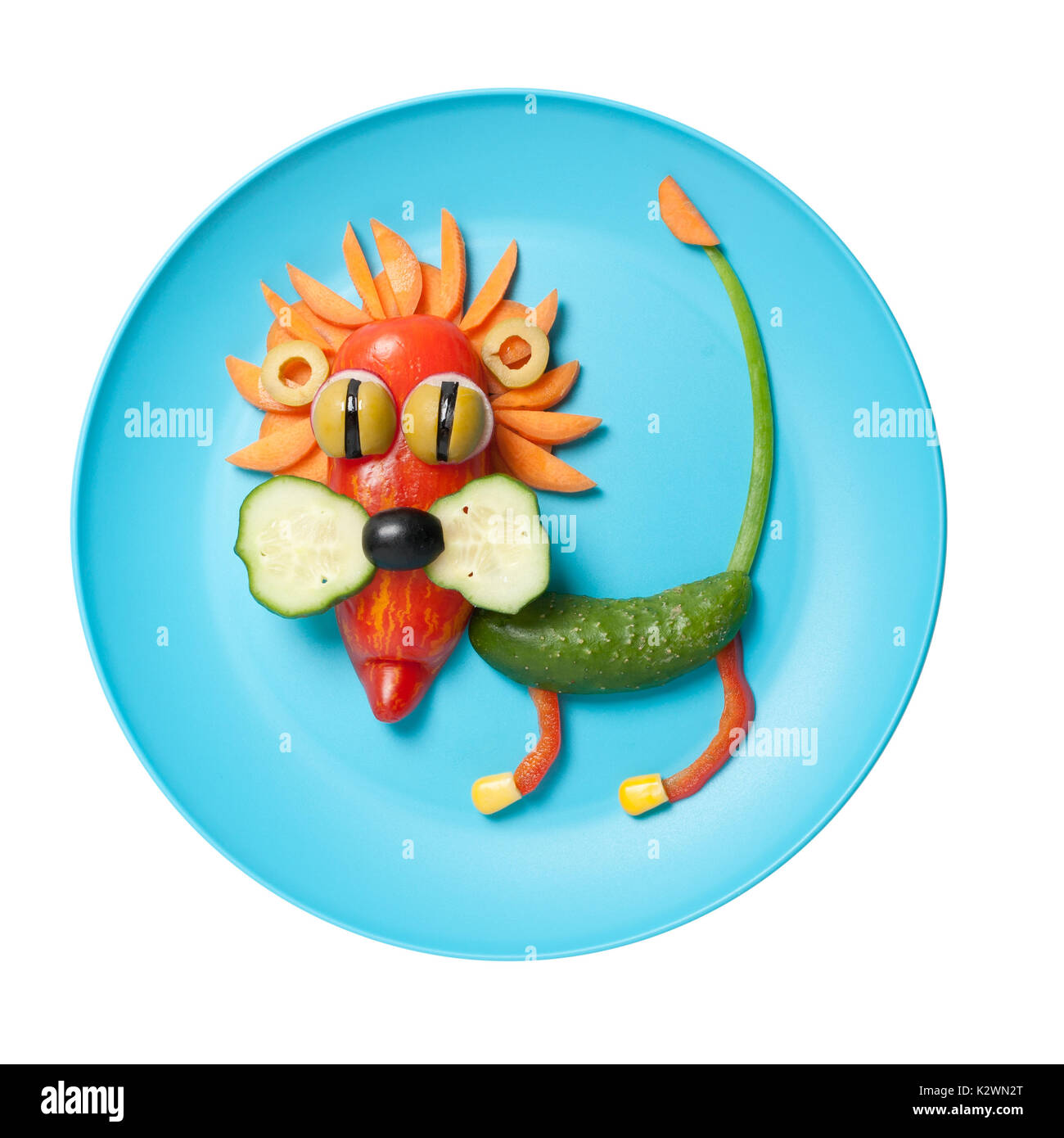 Funny vegetable lion made on blue plate Stock Photo - Alamy