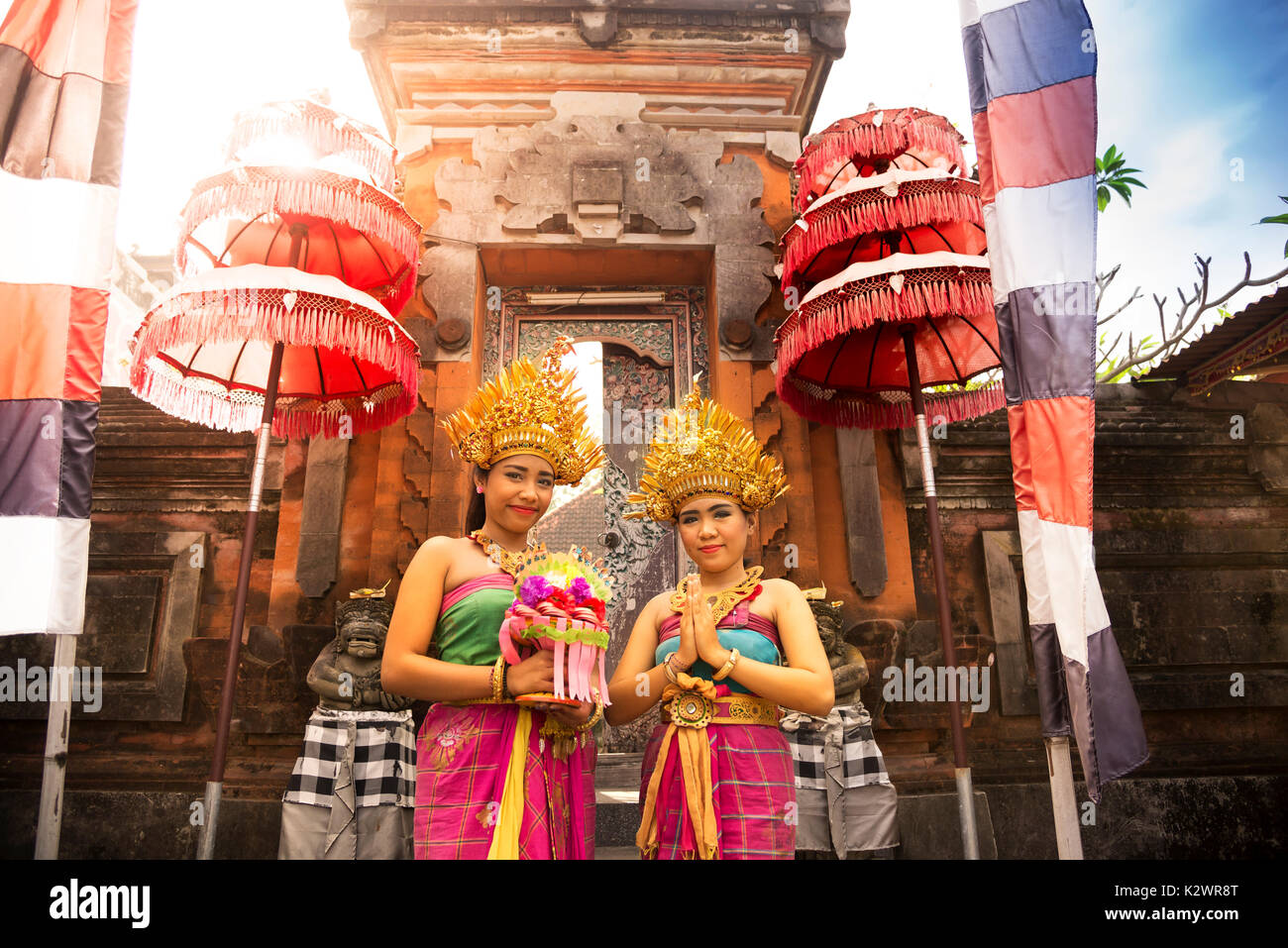 Bali, Indonesia - July 06, 2017. Two traditional Balinese dressed girl ...