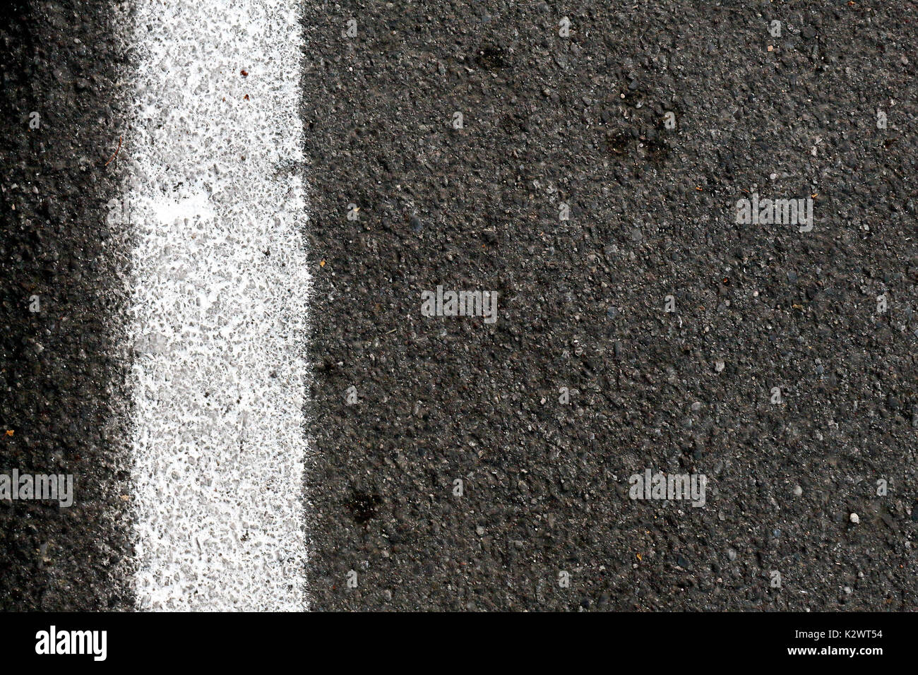 Closeup of road surface with white paint line, vertical Stock Photo - Alamy