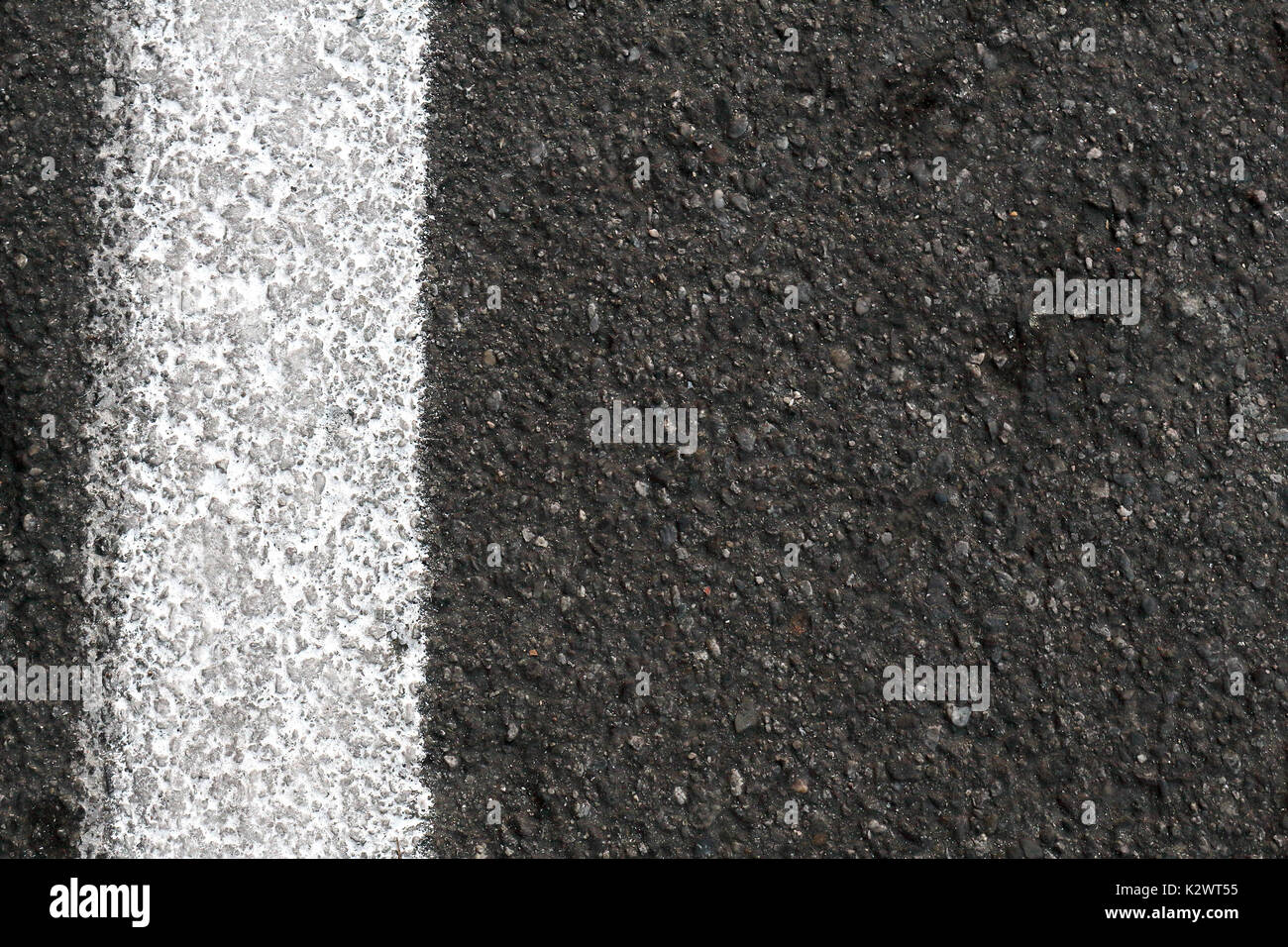 Closeup of road surface with white paint line, vertical Stock Photo - Alamy