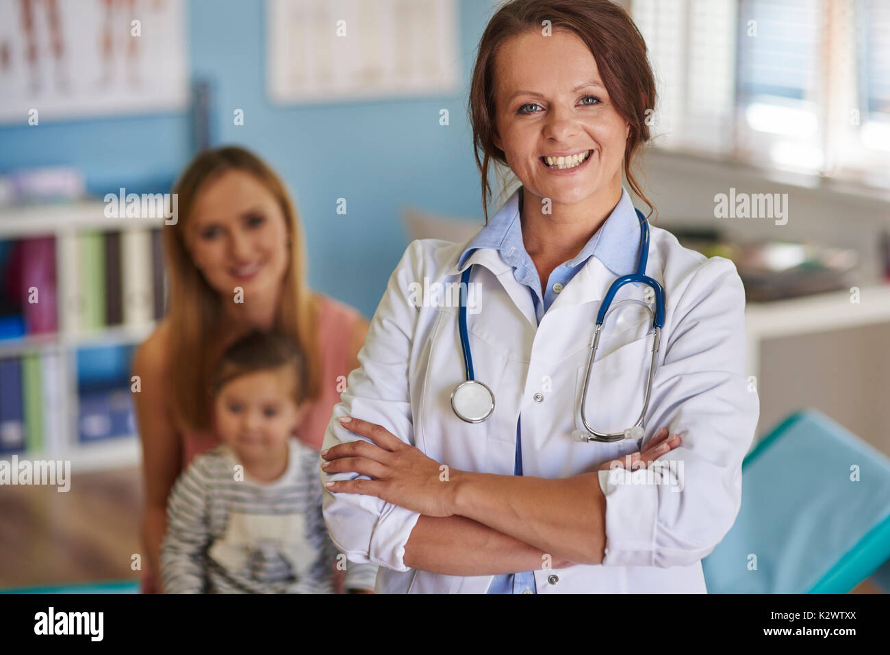 Cheerful doctor and her patients Stock Photo - Alamy