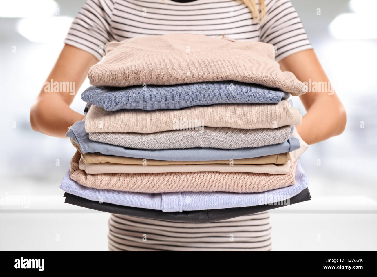 Pile clothes woman hi-res stock photography and images - Alamy