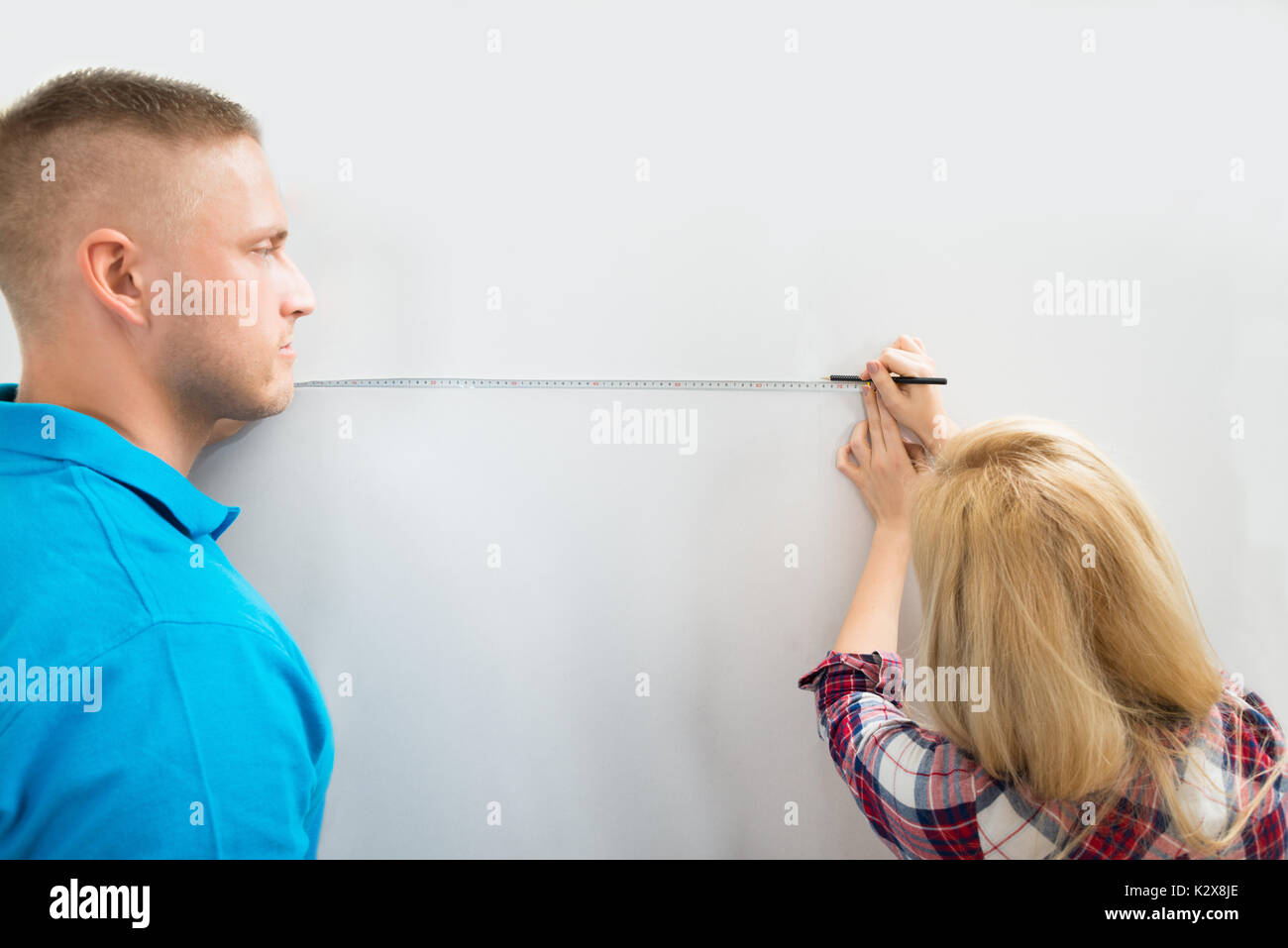 Woman husband measuring together hi-res stock photography and images ...