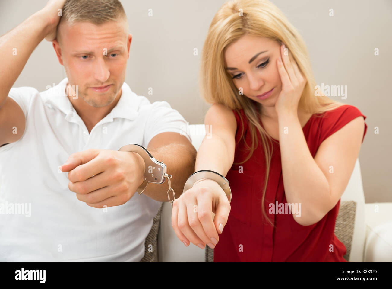 Woman with handcuffs hi-res stock photography and images - Alamy