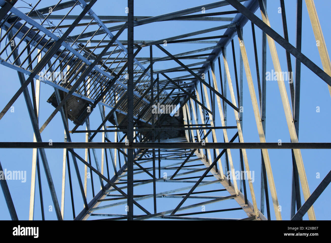 Large tower of metal structures against the blue sky. Metal ...