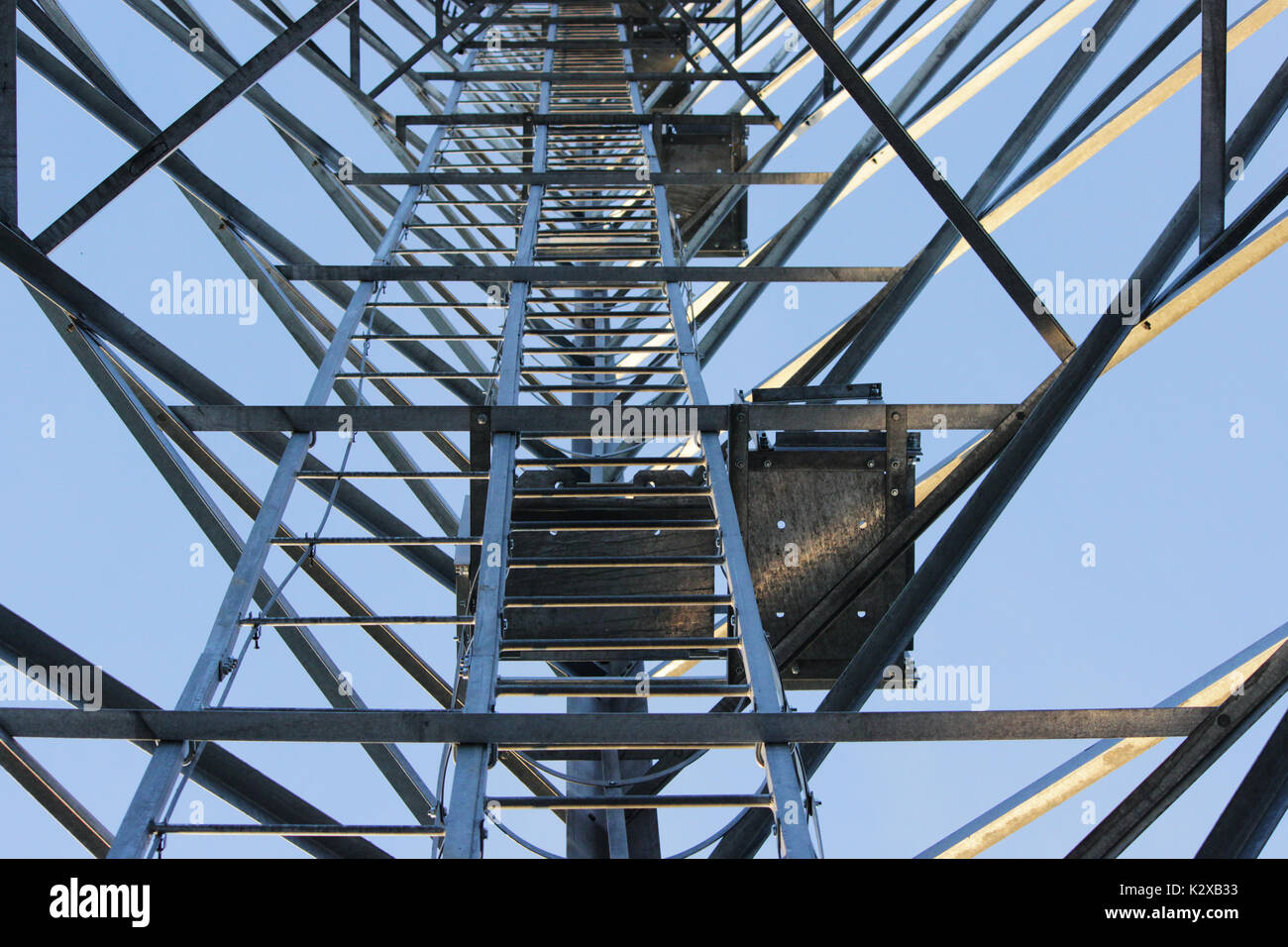 Large tower of metal structures against the blue sky. Metal ...