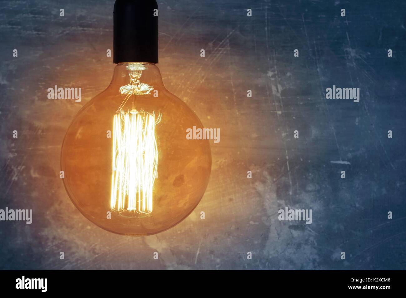 Colorful image of a large burning retro light bulb. Concept of ideas ...