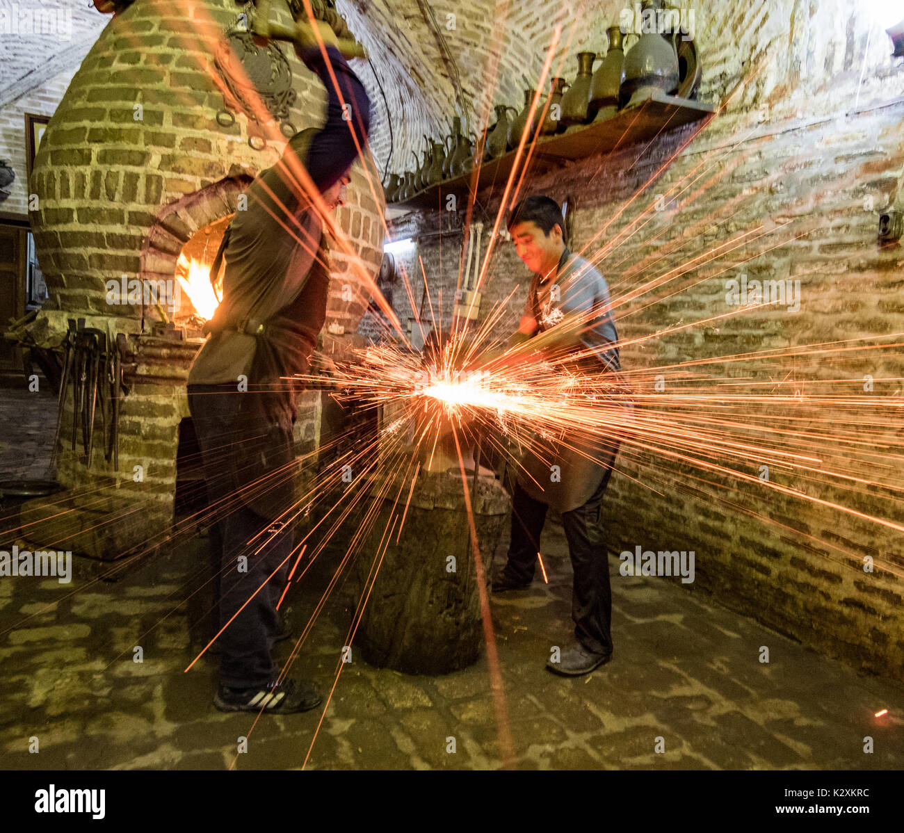 Two blacksmiths shape metal hi-res stock photography and images - Alamy