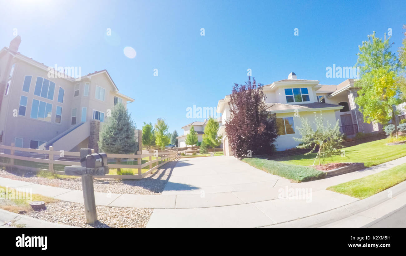 Driving through residential neighborhood in suburbia Stock Photo - Alamy