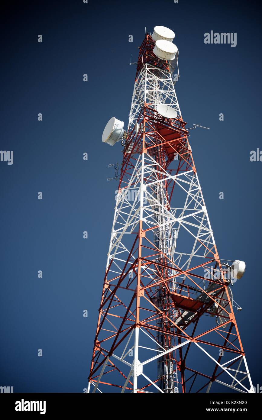 Telecommunications tower with clear blue sky Stock Photo - Alamy