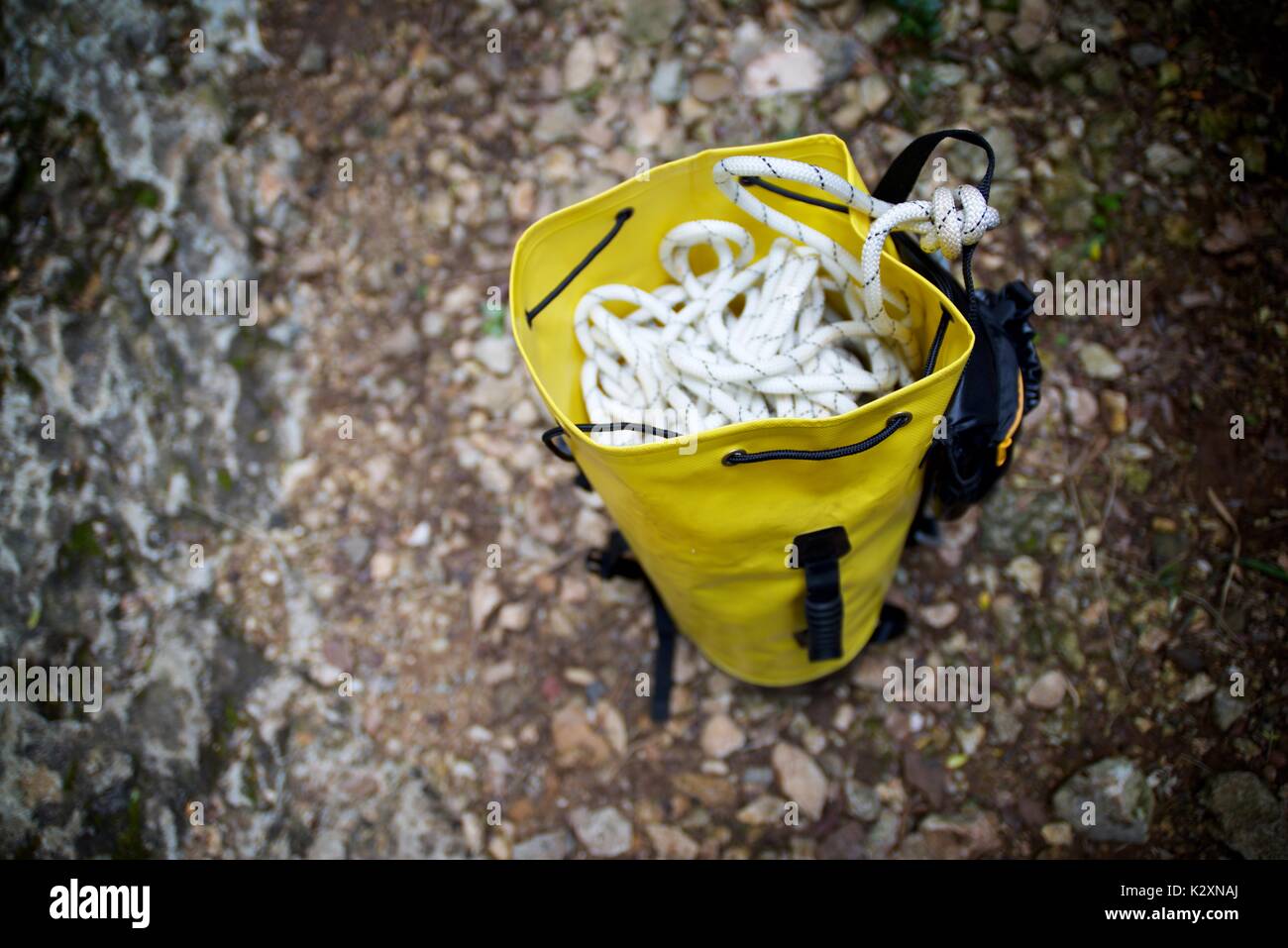 Climbing rope inside a yellow backpack Stock Photo - Alamy