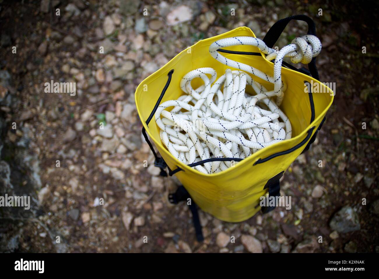 Climbing rope inside a yellow backpack Stock Photo - Alamy