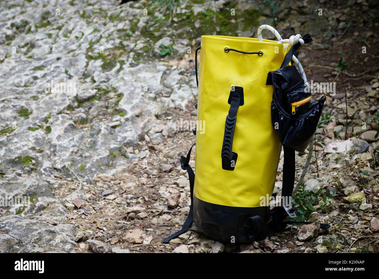 Climbing rope inside a yellow backpack Stock Photo - Alamy