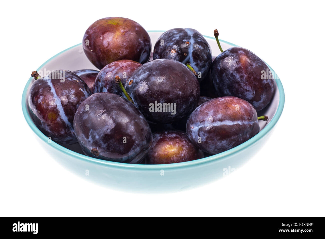 Mellow sweet plum in plate on white background. Studio Photo Stock ...