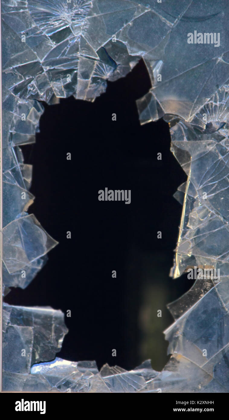 background broken window during riots. glass pieces hole mayhem Stock ...