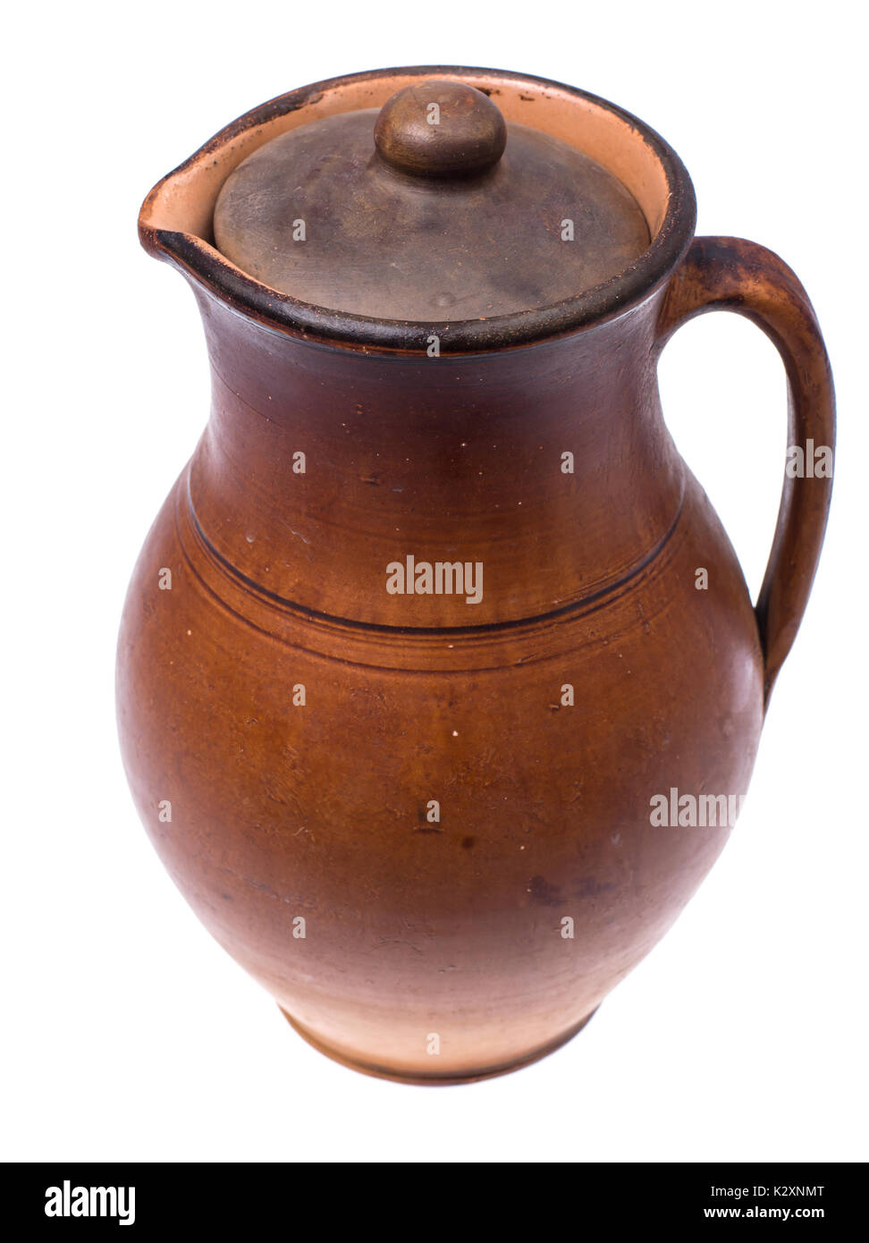 Clay pitcher with lid for water and milk, isolated on white background ...