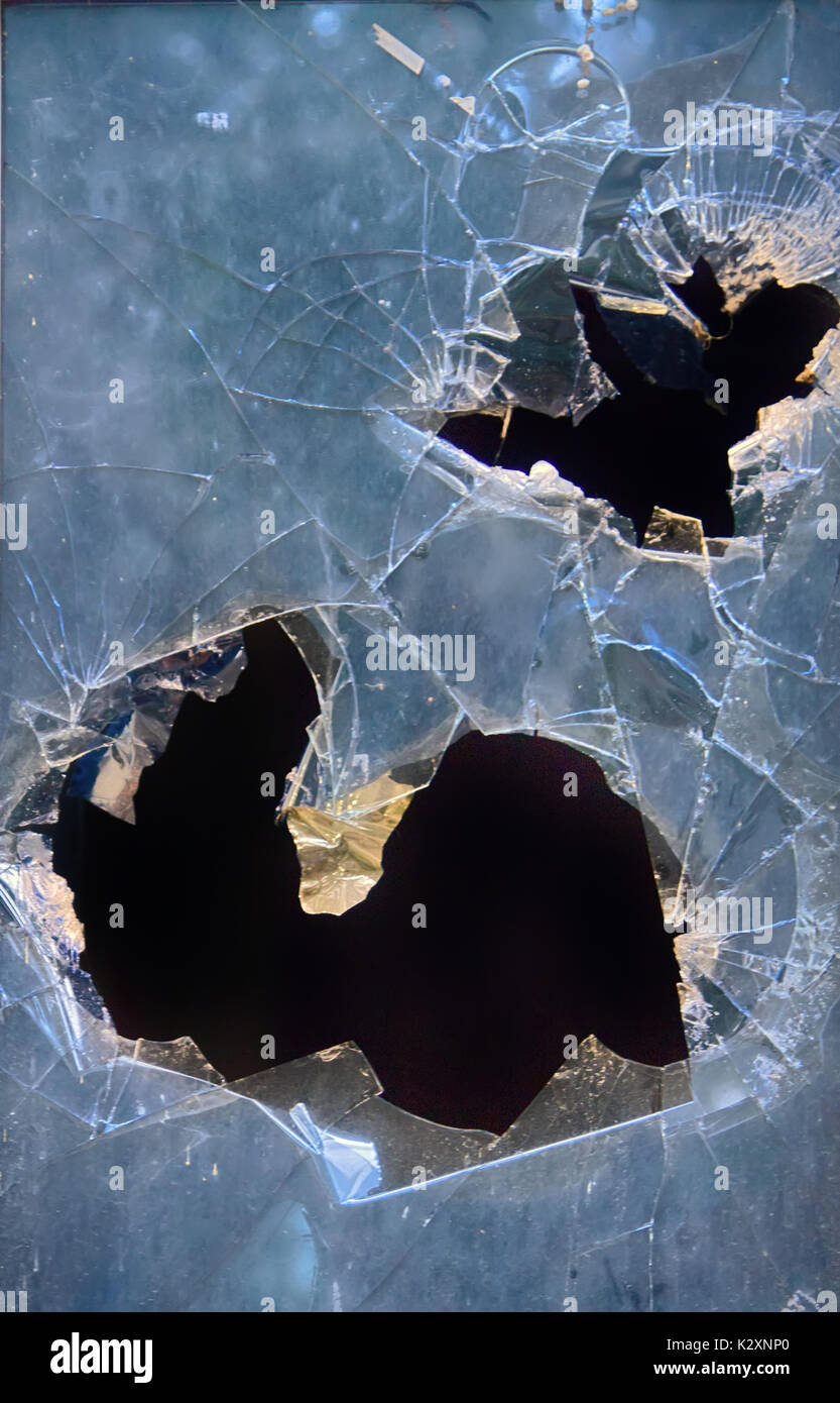background broken window during riots. glass pieces hole mayhem Stock ...