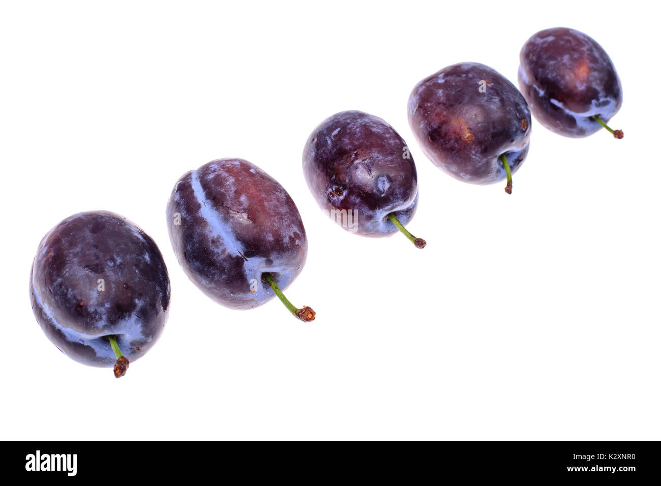 Prunes whole and cut, isolated on white background. Studio Photo Stock ...