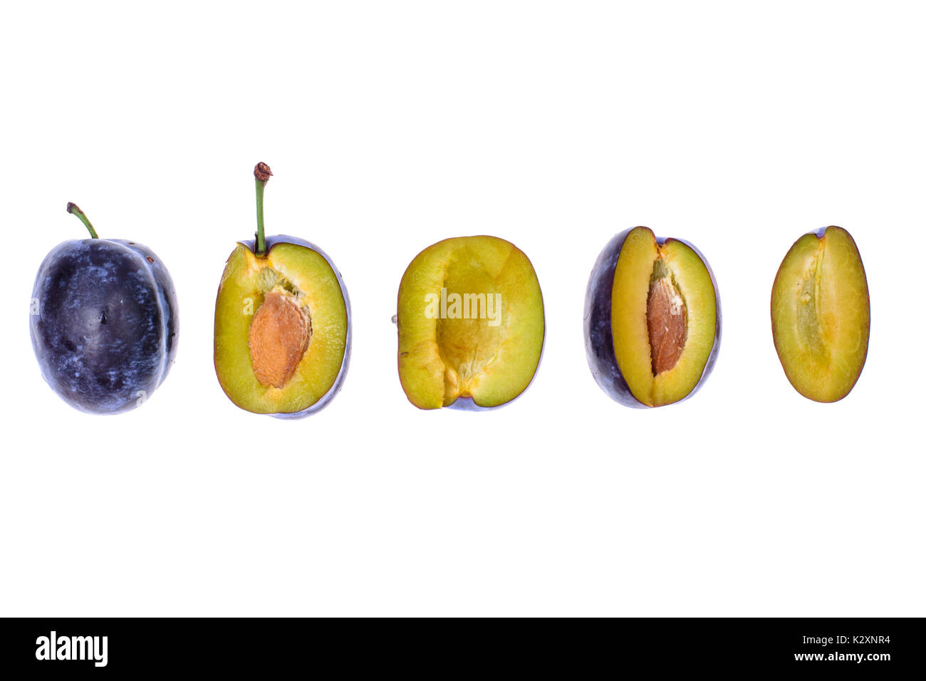Prunes whole and cut, isolated on white background. Studio Photo Stock ...
