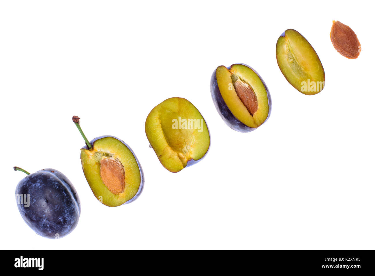 Prunes whole and cut, isolated on white background. Studio Photo Stock ...