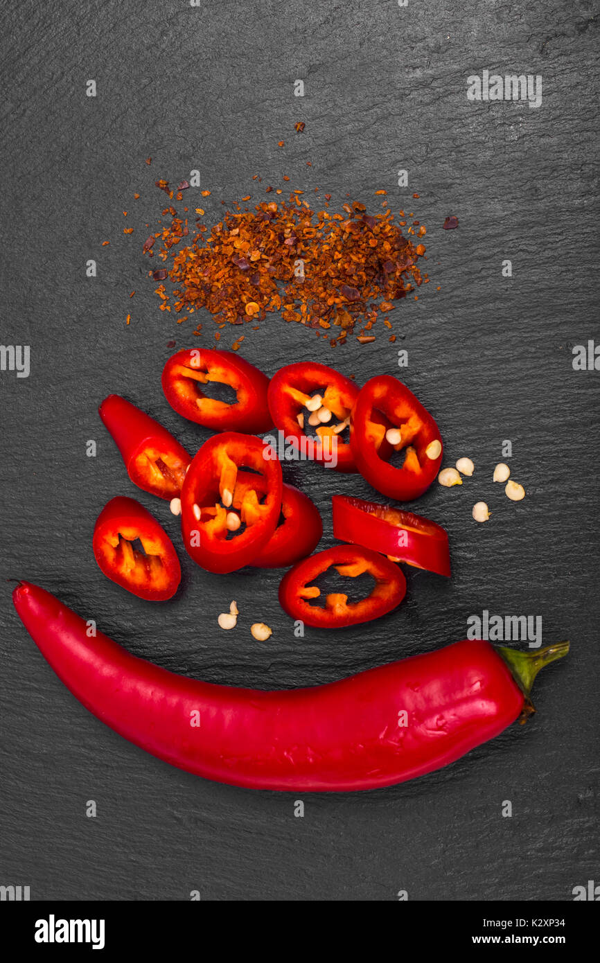 Spice in cooking red chili pepper on black stone. Studio Photo Stock ...