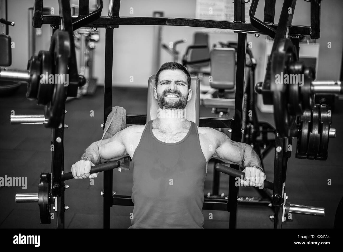 The powerful athlete doing exercises on pectoral muscles Stock Photo ...