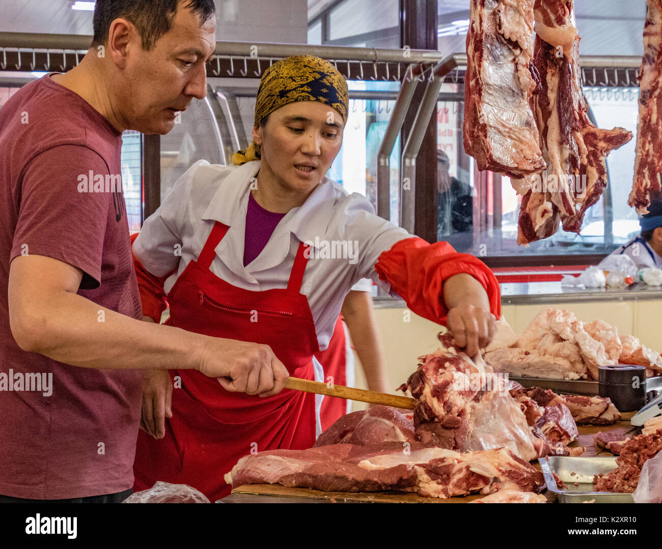 Vendor sells meat at a local market in Bishkek, Kyrgyzstan on May 27 ...