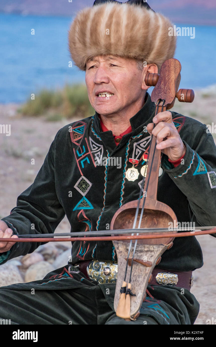 Musicians play traditional instruments in Issyk Kul, Kyrgyzstan on May ...