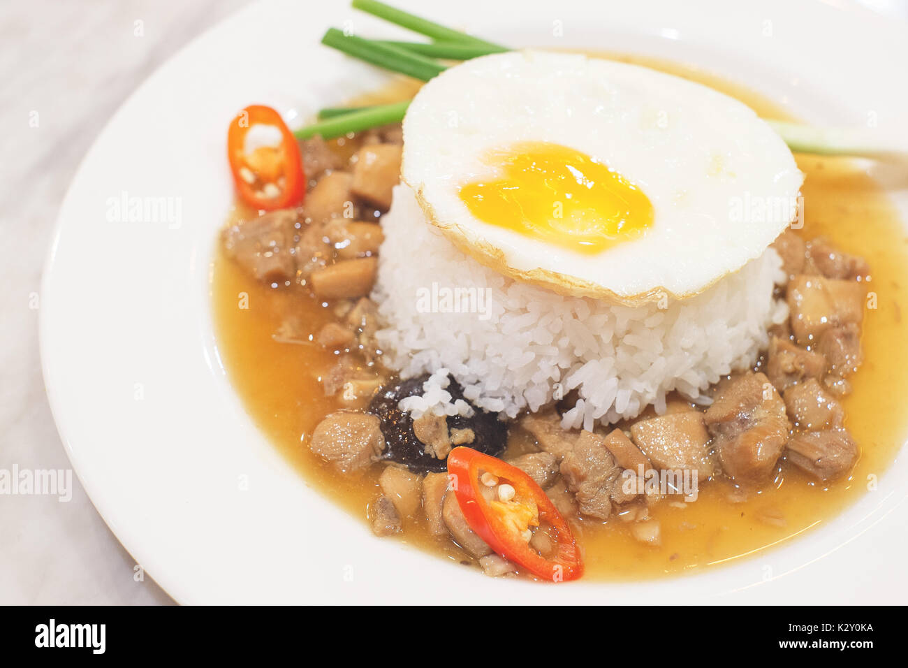 chicken rice with fried egg Stock Photo - Alamy