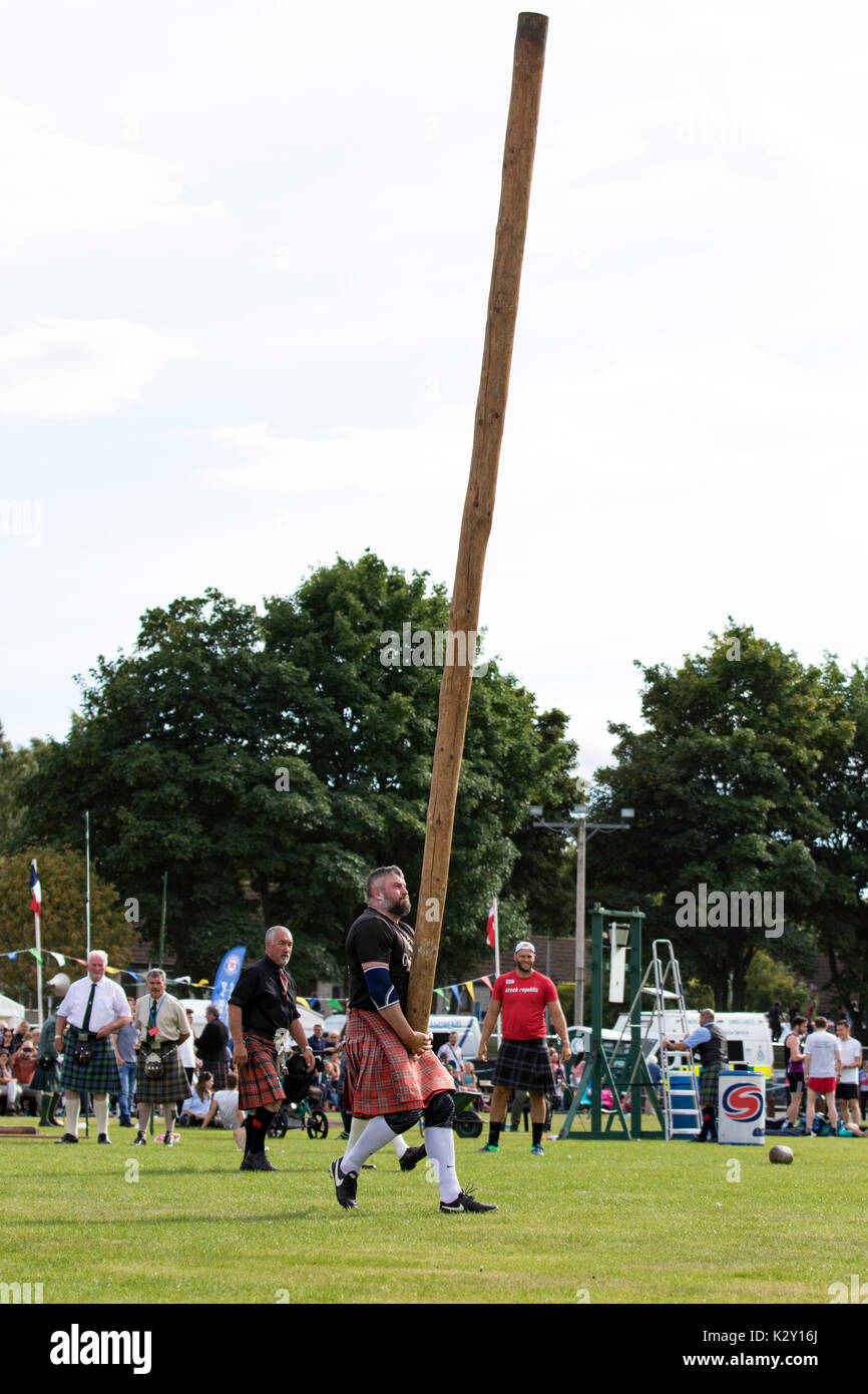 Ballater, Scotland - Aug 10, 2017: A competitor in the caber toss, a ...