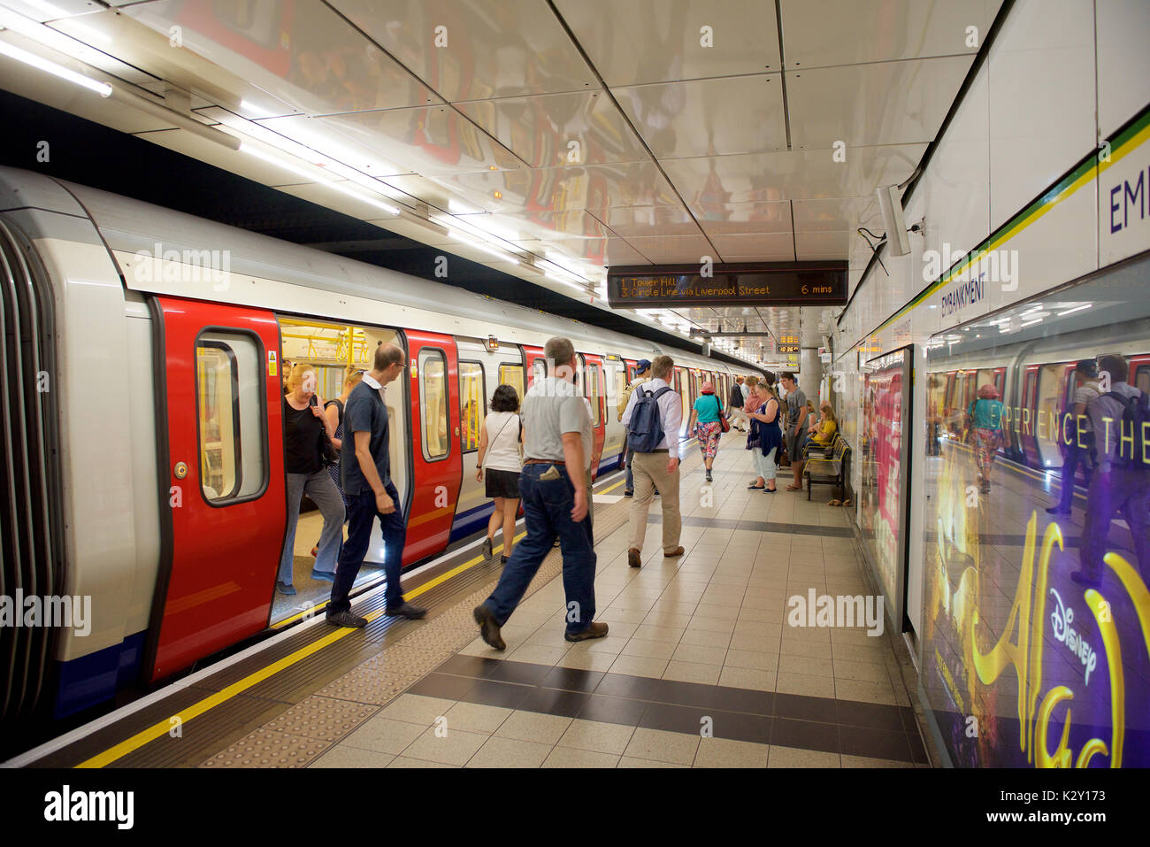 Passengers getting off a train at Embankment station on the London ...
