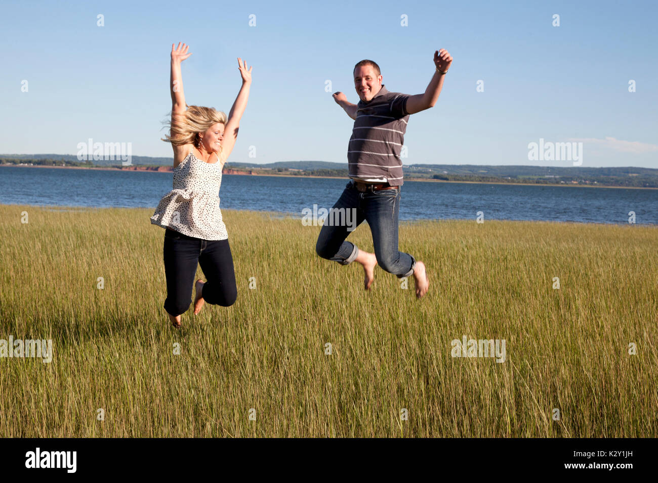 Couple jump joy hi-res stock photography and images - Alamy