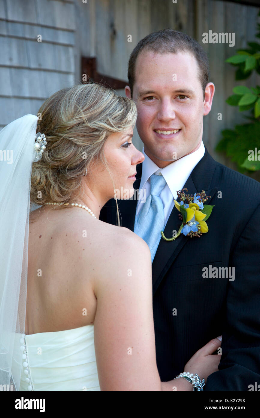 Portrait of happy newlywed bride and groom, woman in white wedding ...