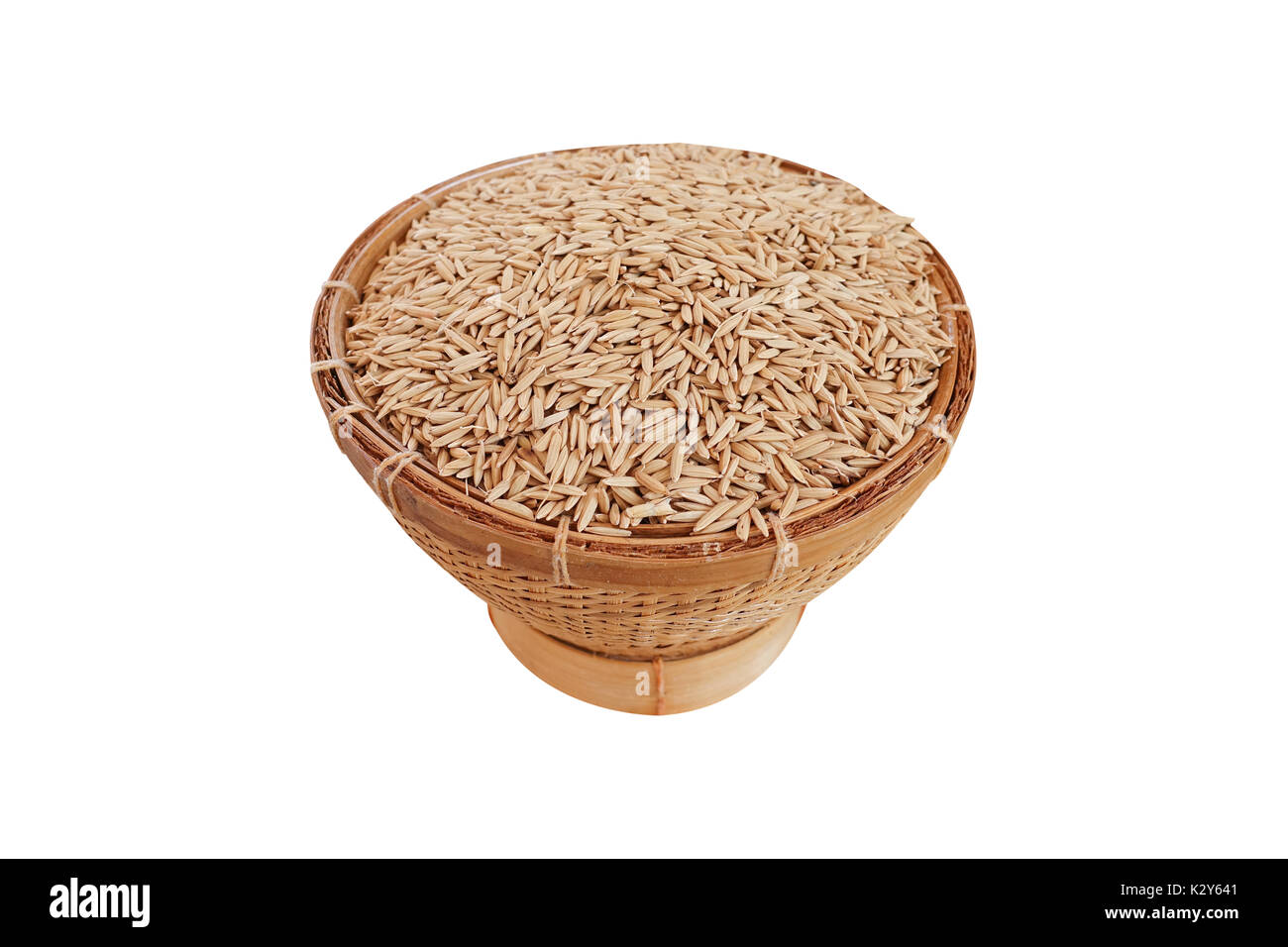 paddy rice in bamboo basket isolated on white background with clipping ...