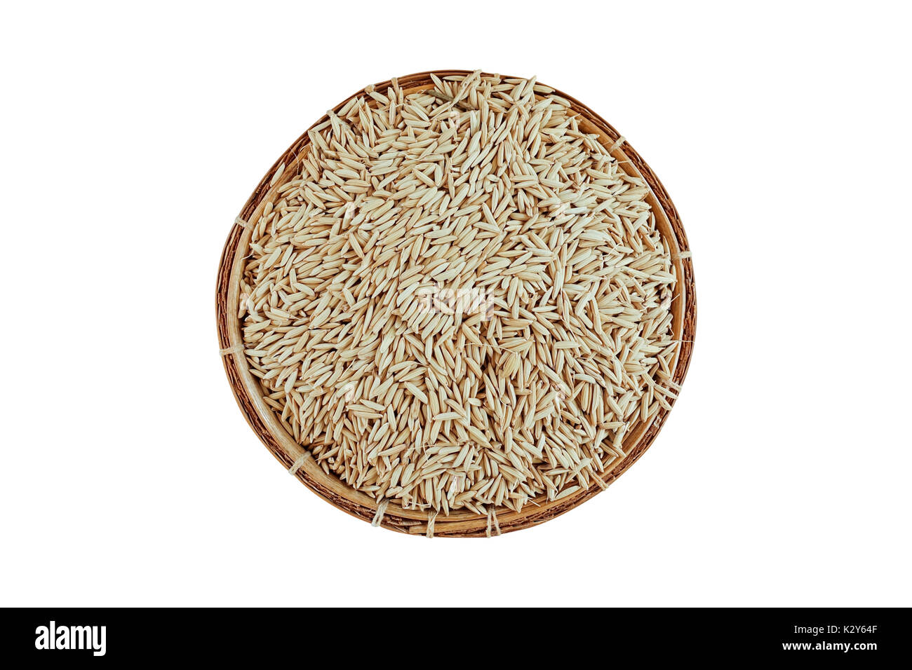 paddy rice in bamboo basket isolated on white background with clipping ...