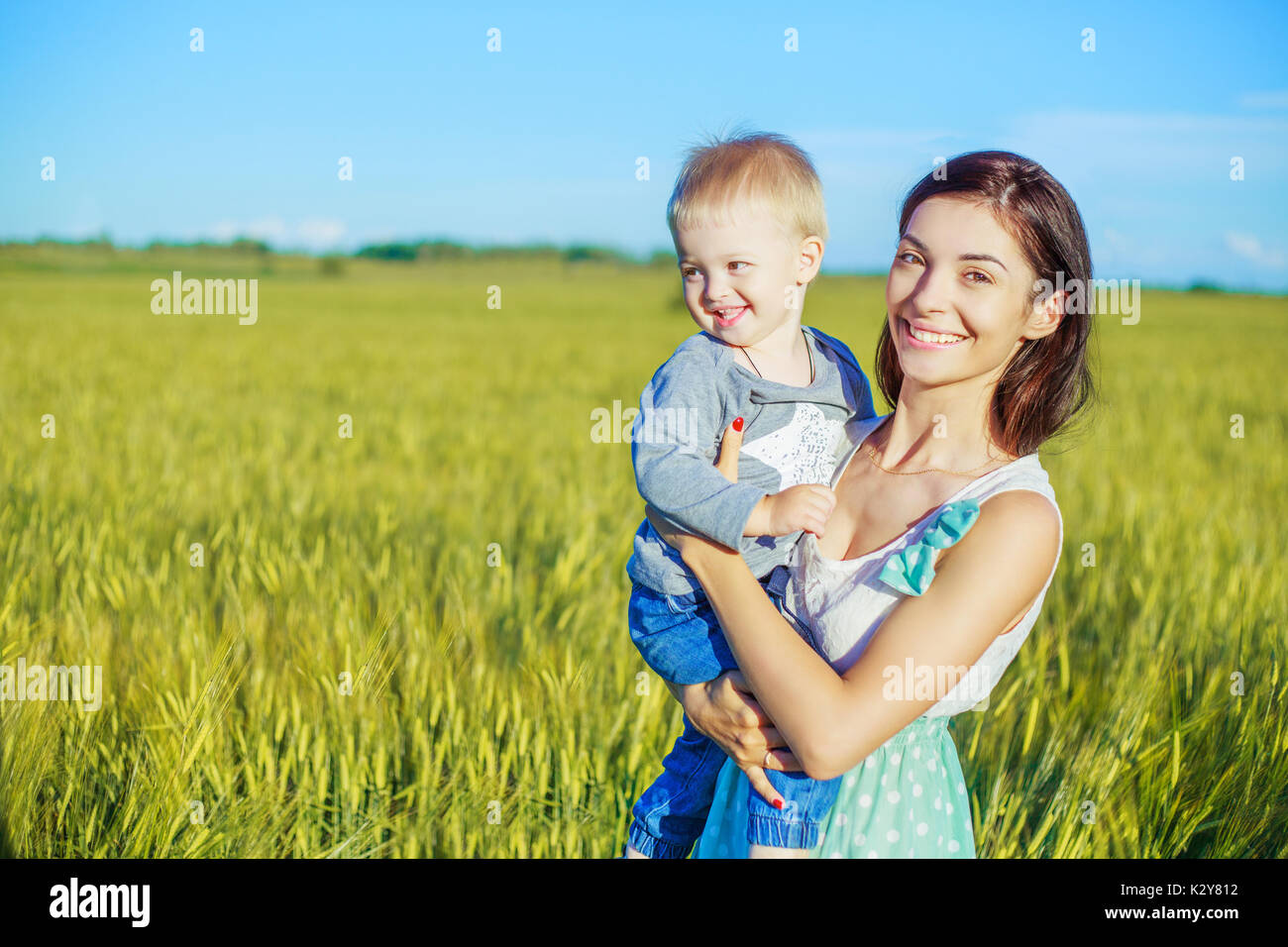 happy young mother and baby in the wheat field Stock Photo - Alamy