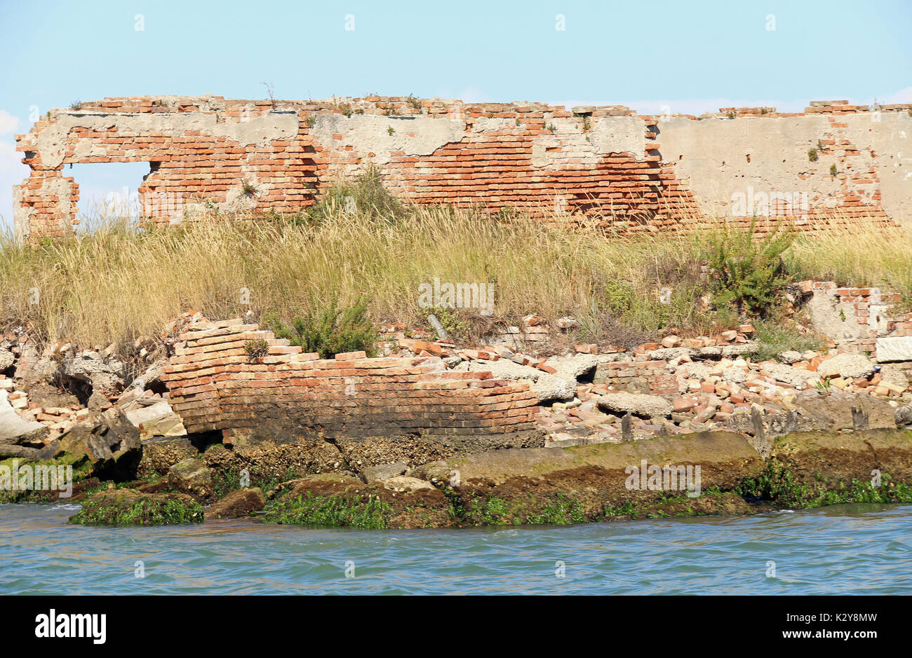Ruin of a destroyed old brick home in the venetian lagoon in Italy ...