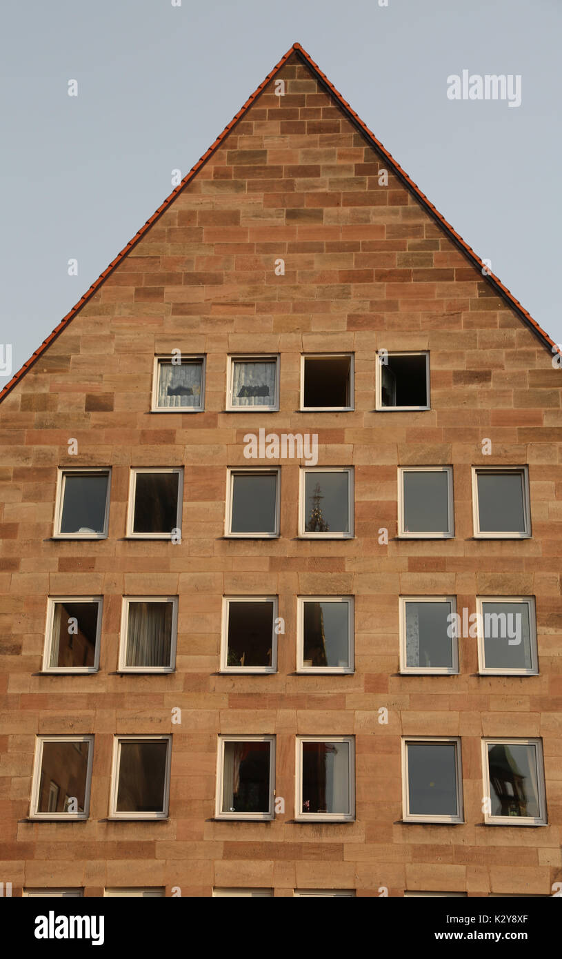 Old house with sloping roof and many windows Stock Photo - Alamy