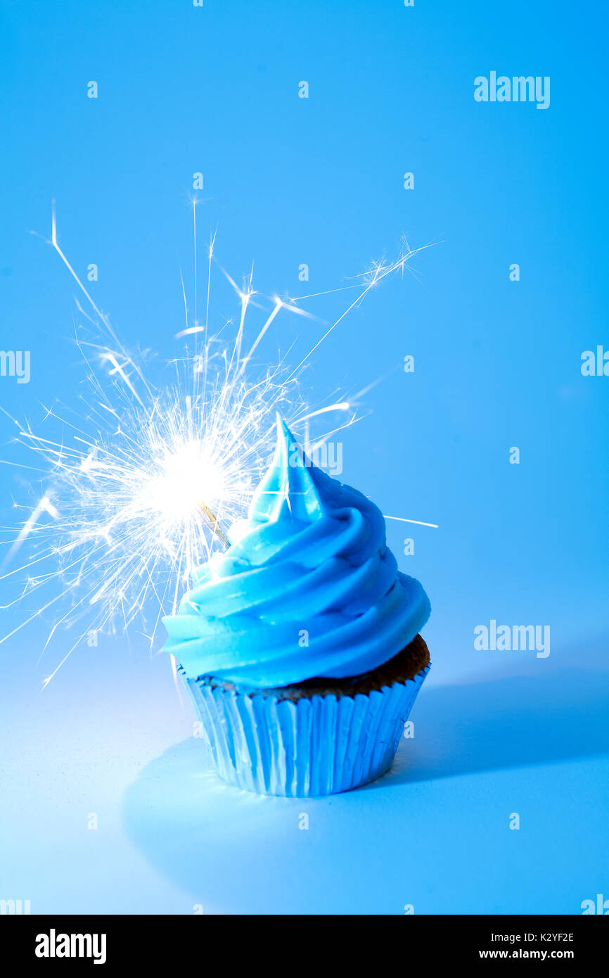 Blue Sparkler Cupcake Stock Photo - Alamy