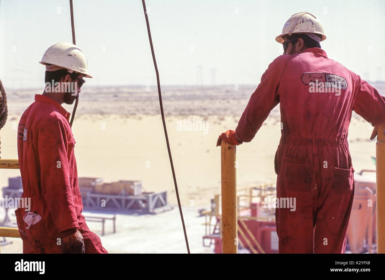 Drilling for oil in the Saudi desert near Abqaiq, by the Arabian ...