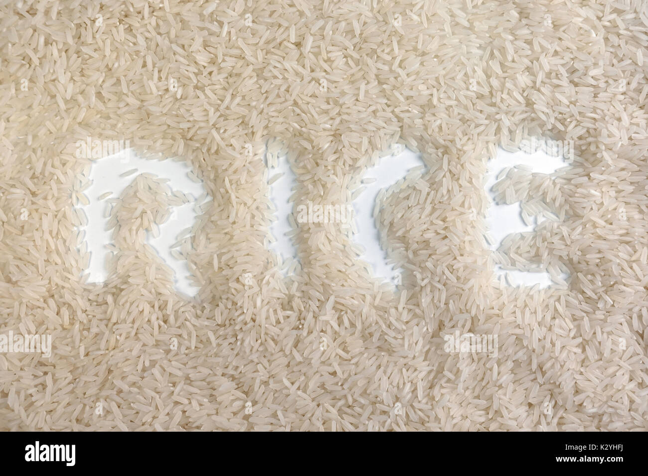 Rice text background Stock Photo - Alamy